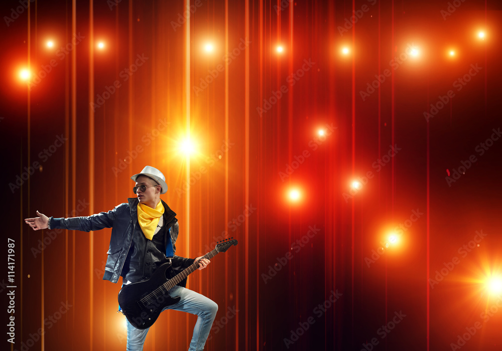 Rock star on stage Stock Photo | Adobe Stock