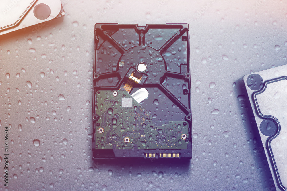 Fotografia do Stock: Hard disk drive covered with water drops ...