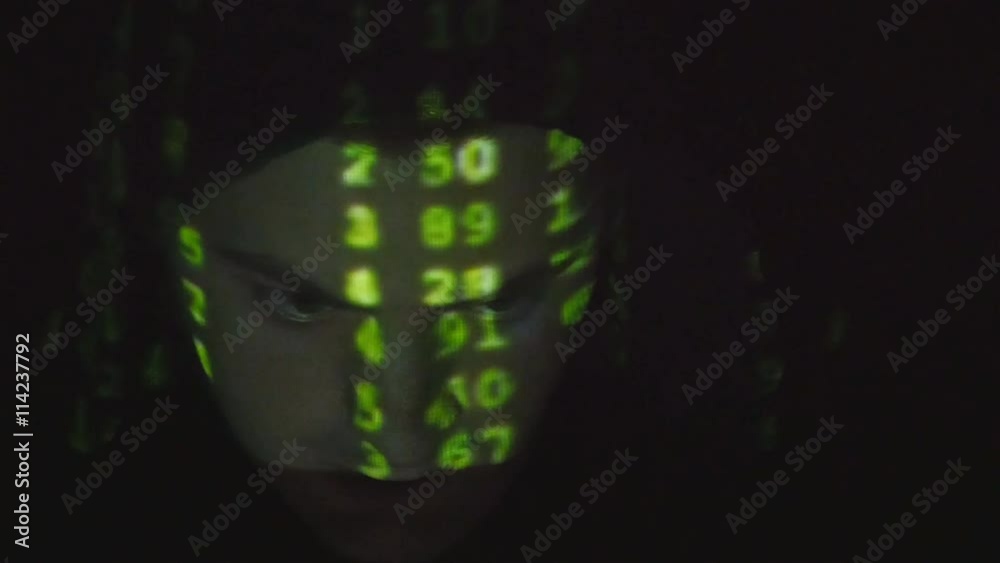 Vidéo Stock Close up shot of male face of hacker with binary code ...
