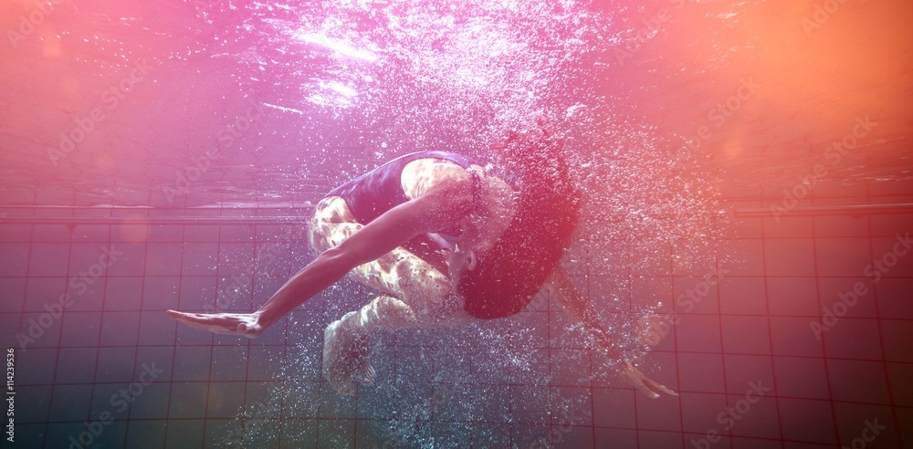 Athletic swimmer doing a somersault underwater Stock-Foto | Adobe Stock