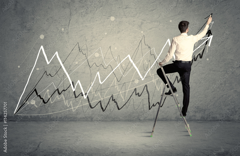 Man on ladder drawing lines Stock Photo | Adobe Stock