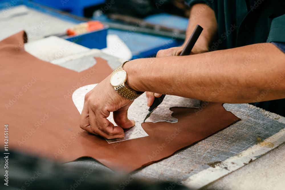 Person in workshop using template, cutting leather Stock Photo | Adobe ...