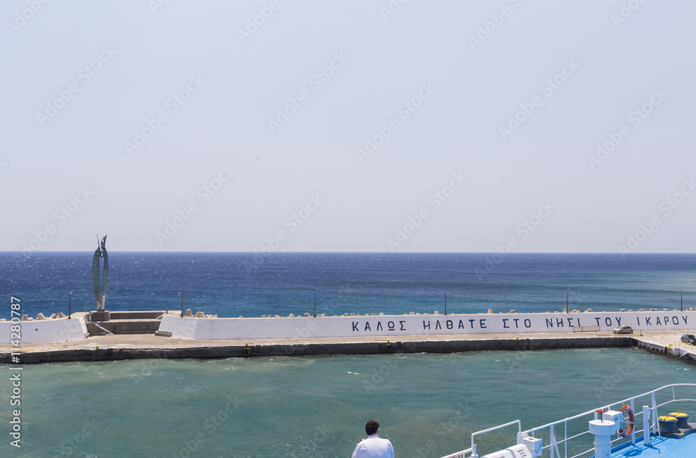 Ikaria island Greece, port "welcome to island of Ikarus" in greek Stock ...