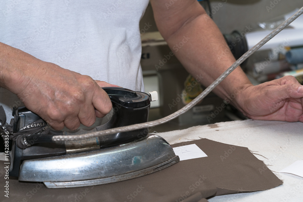 Production process of suit tailoring. Ironing of parts of a tailored ...