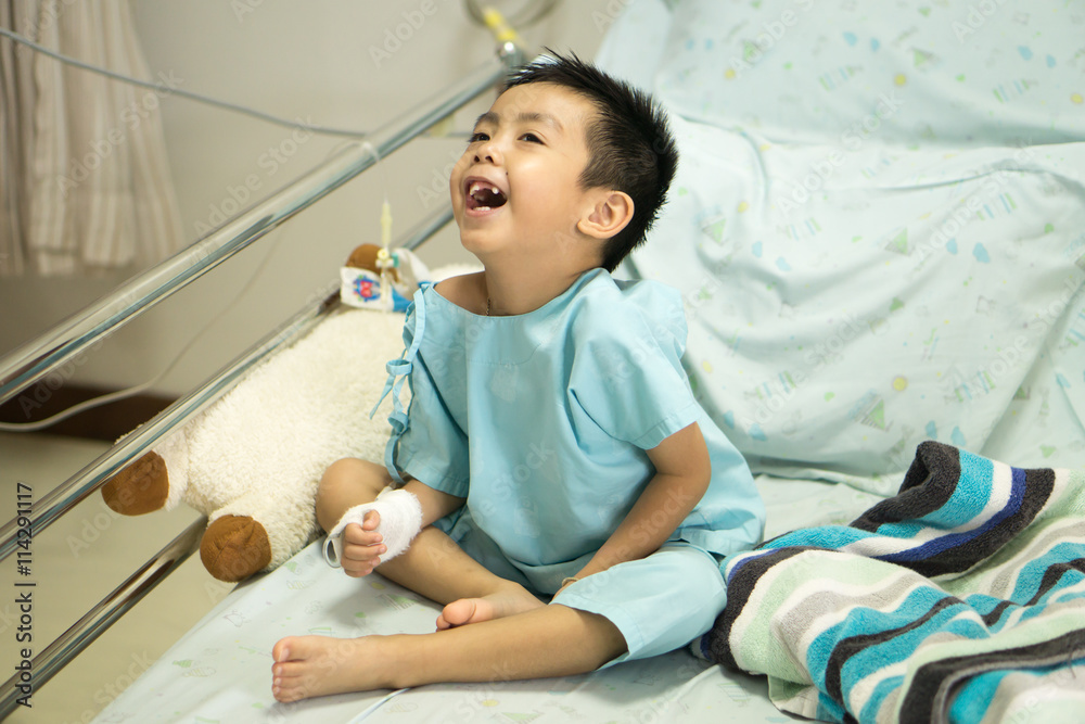 A sick Little boy in hospital bed. Stock Photo | Adobe Stock