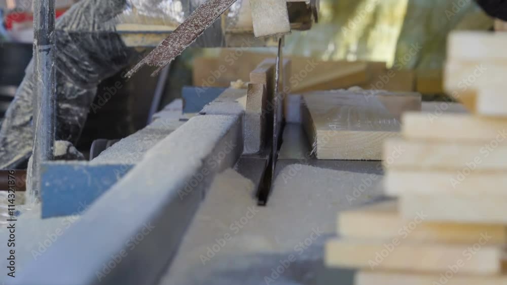 The process of cutting woods in half using a wood cutter that has a ...