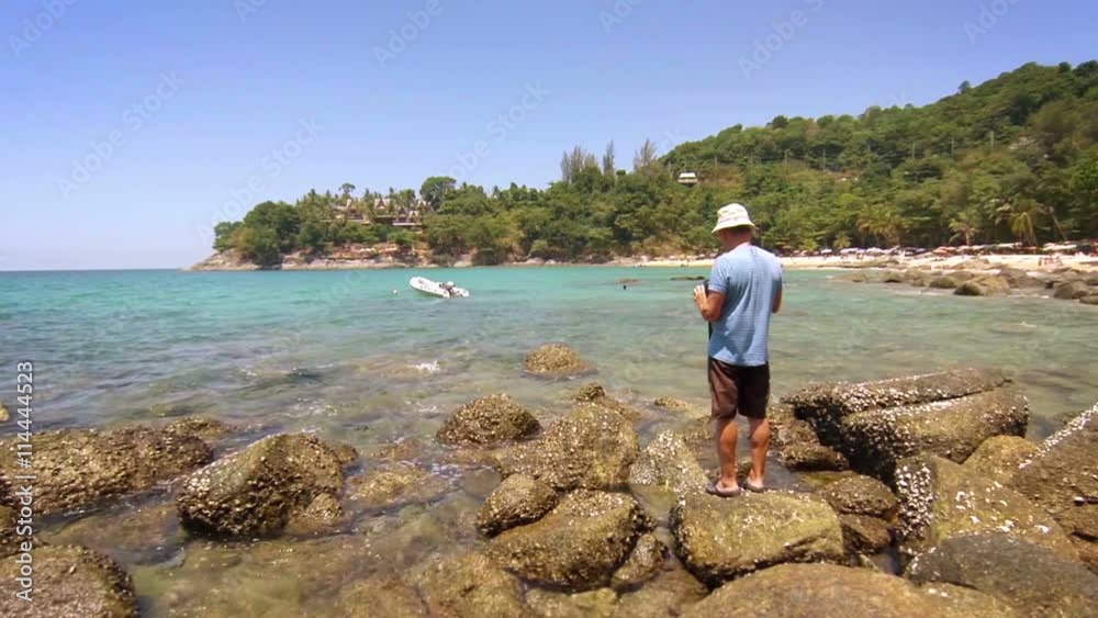 Video 1920X1080 - Solitary tourist, standing atop a barnacle-encrusted ...