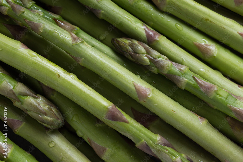 Bunch of asparagus on a table. Uncooked pile raw for organic ...