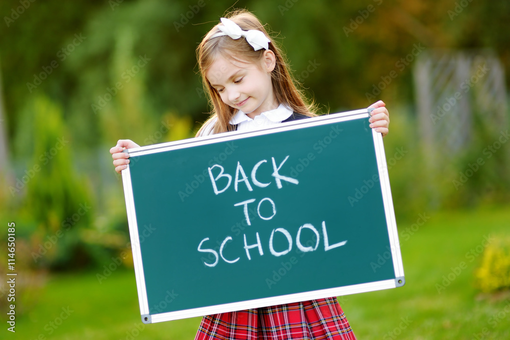 Cute little schoolgirl feeling excited about going back to school Stock ...