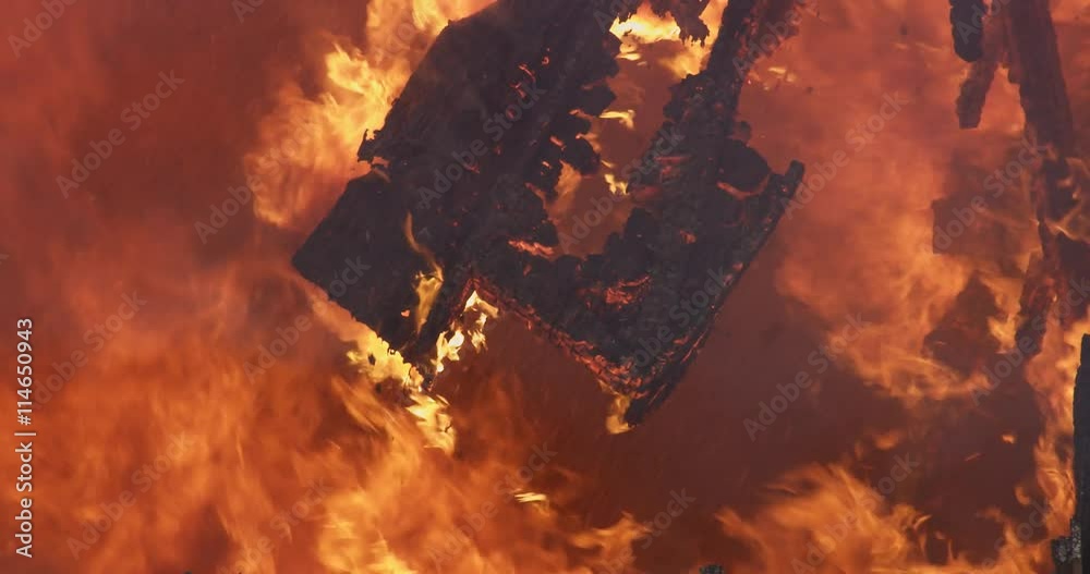 The charred remains of the roof and ceiling collapse in a raging fire ...