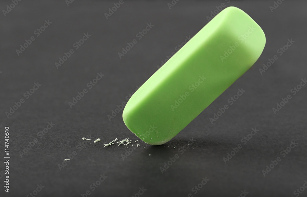 Green eraser on dark background Stock Photo | Adobe Stock