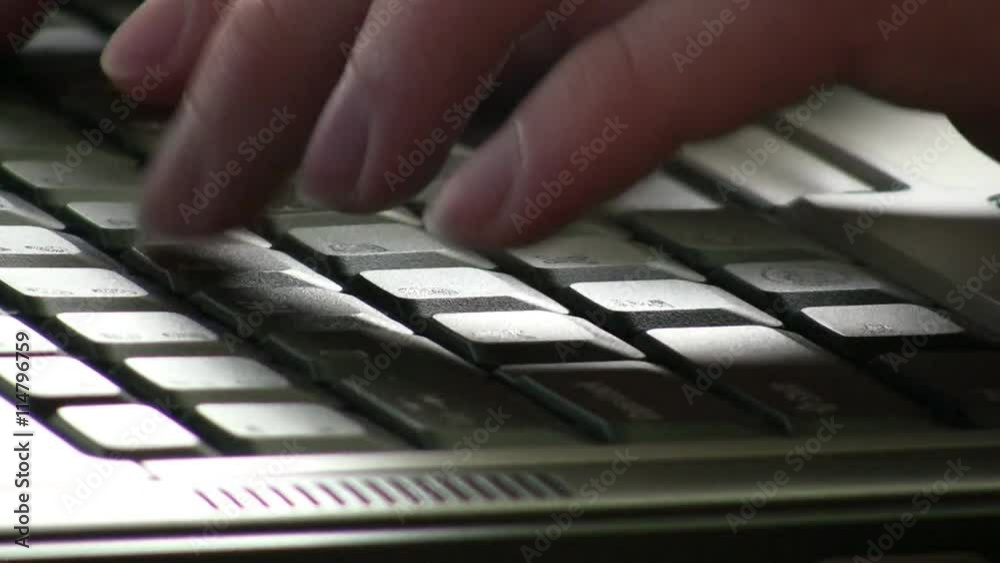 Fast typer using keyboard to input data into a laptop. Stock Video ...