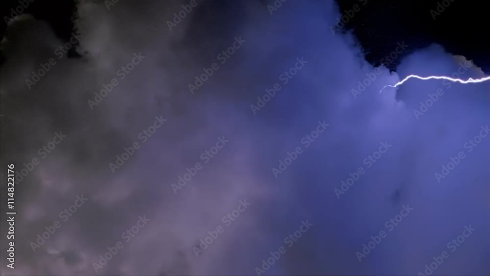 Lightning effects striking rolling clouds from left, right, and center ...