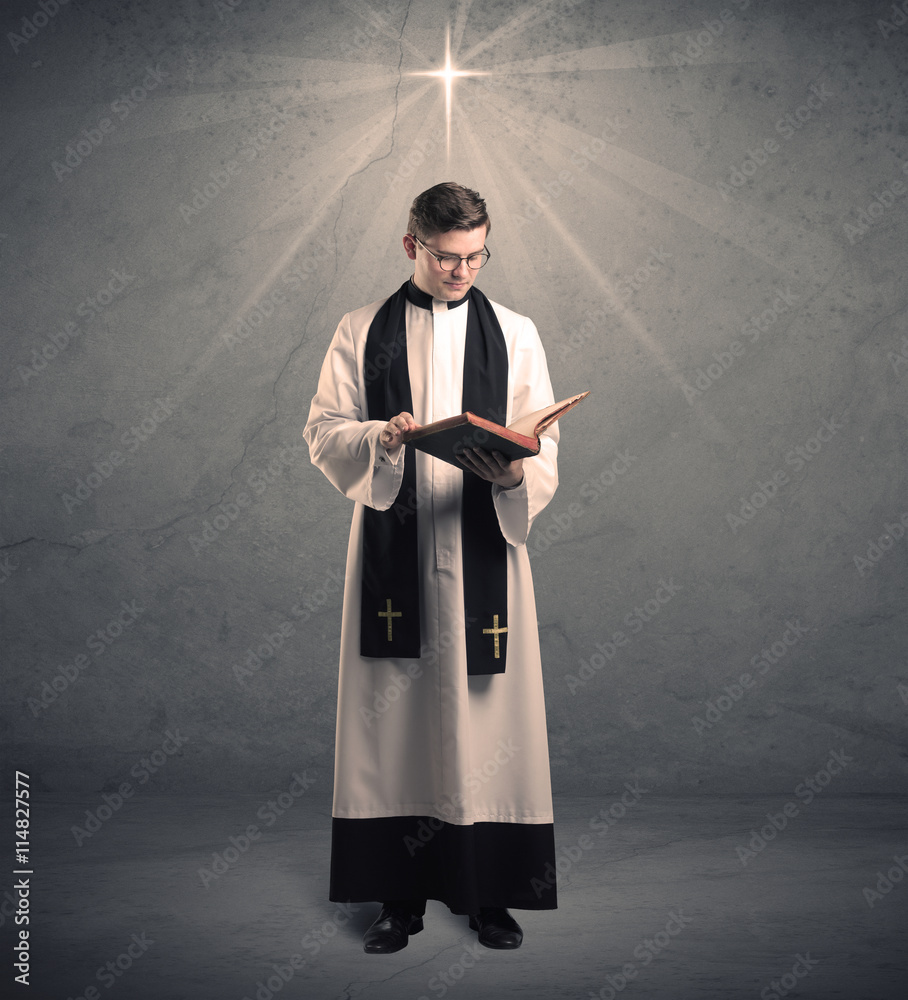 young priest in giving his blessing Stock Photo | Adobe Stock
