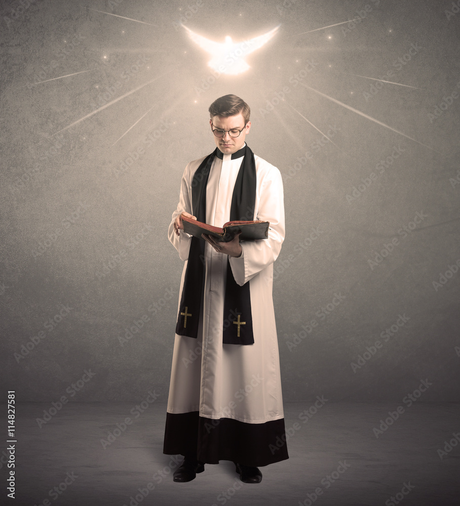 young priest in giving his blessing Stock Photo | Adobe Stock