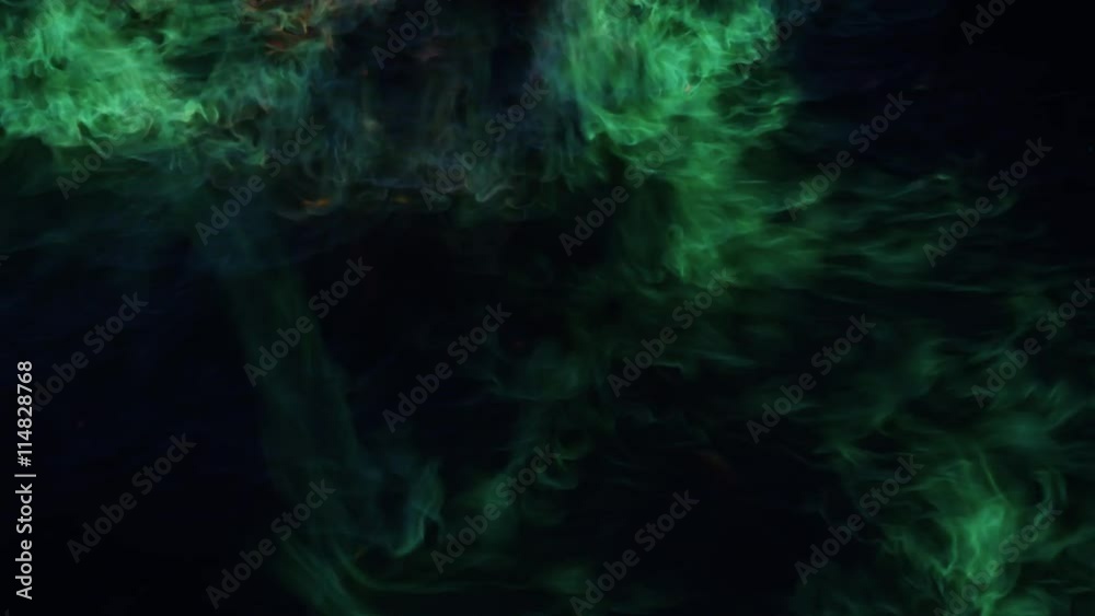 Green flames flowing across the frame, creating a tornado of fire at ...