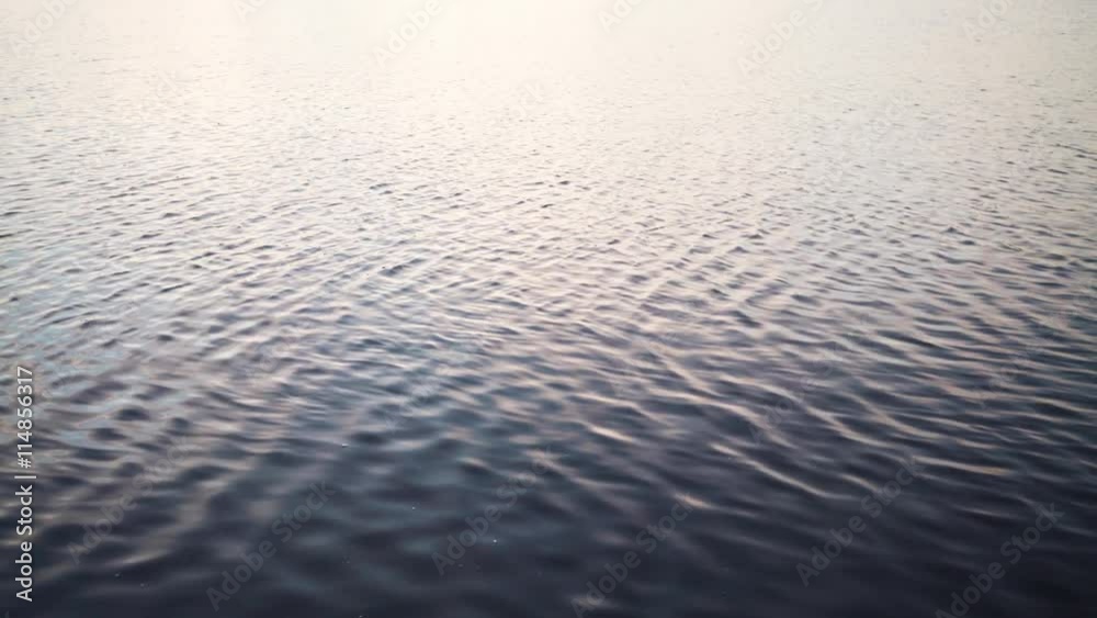 calm water surface background in eveling sunset light Stock Video ...