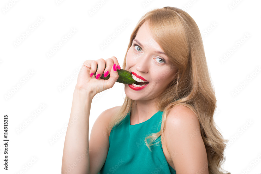 young woman eating cucumber. Stock Photo | Adobe Stock