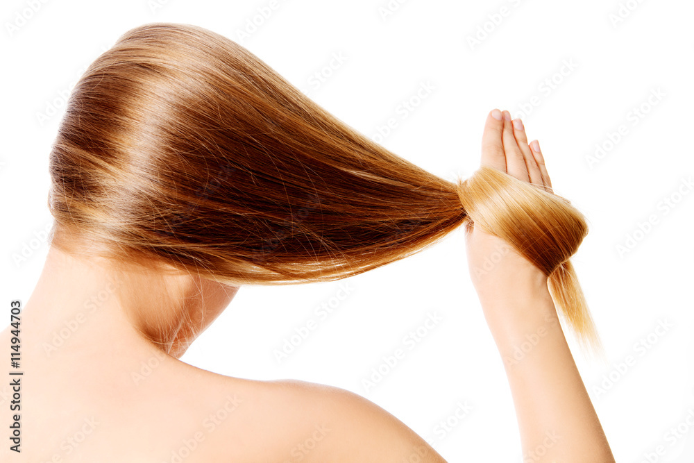 Hand holding hair. Isolated on white. Stock Photo | Adobe Stock