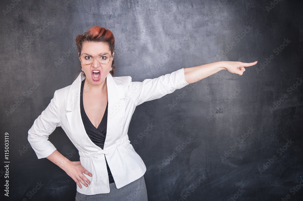 Angry screaming teacher pointing out blackboard background Stock Photo ...