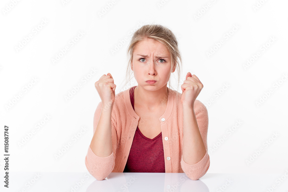 Fotografia do Stock: irritated young blond woman puffing out her cheeks ...
