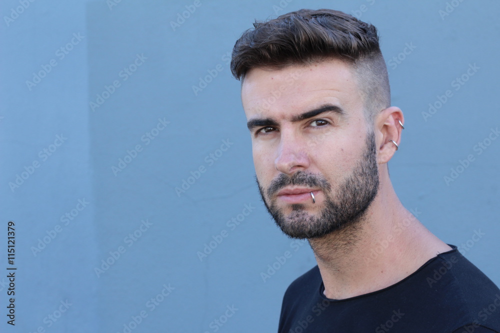 Angry man with piercings and radical haircut Stock Photo | Adobe Stock