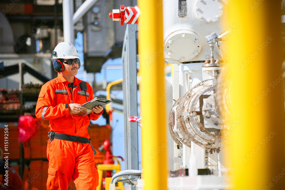 operator recording operation of oil and gas process at oil and rig ...