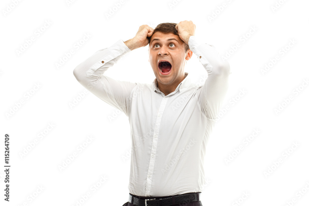 Screaming businessman holding his head Stock Photo | Adobe Stock