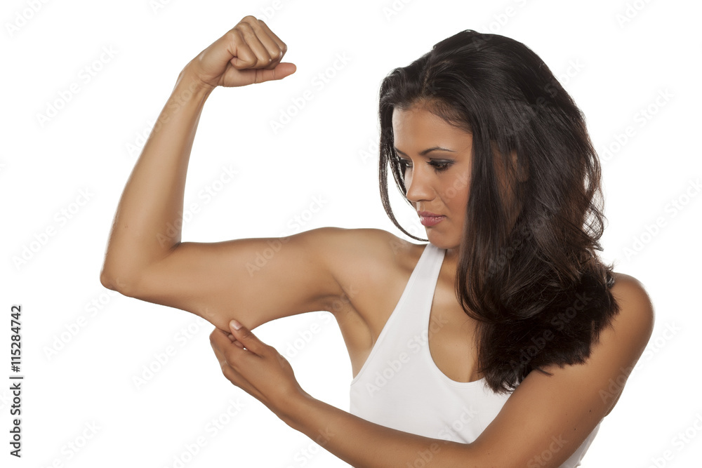 young sad woman pinching the skin on her arm Stock Photo | Adobe Stock