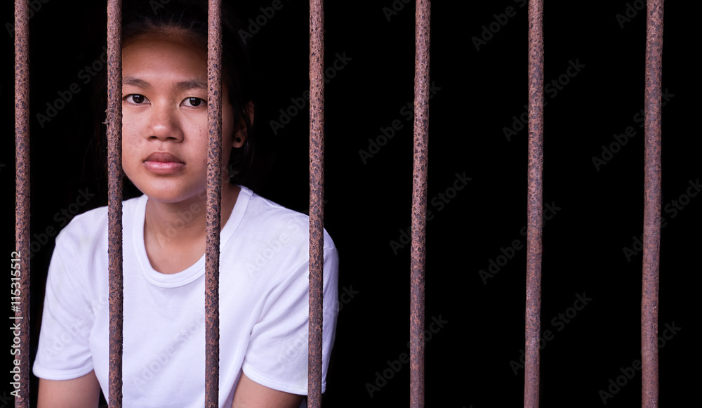 Girl in cage with eye sad and hopeless Stock Photo | Adobe Stock
