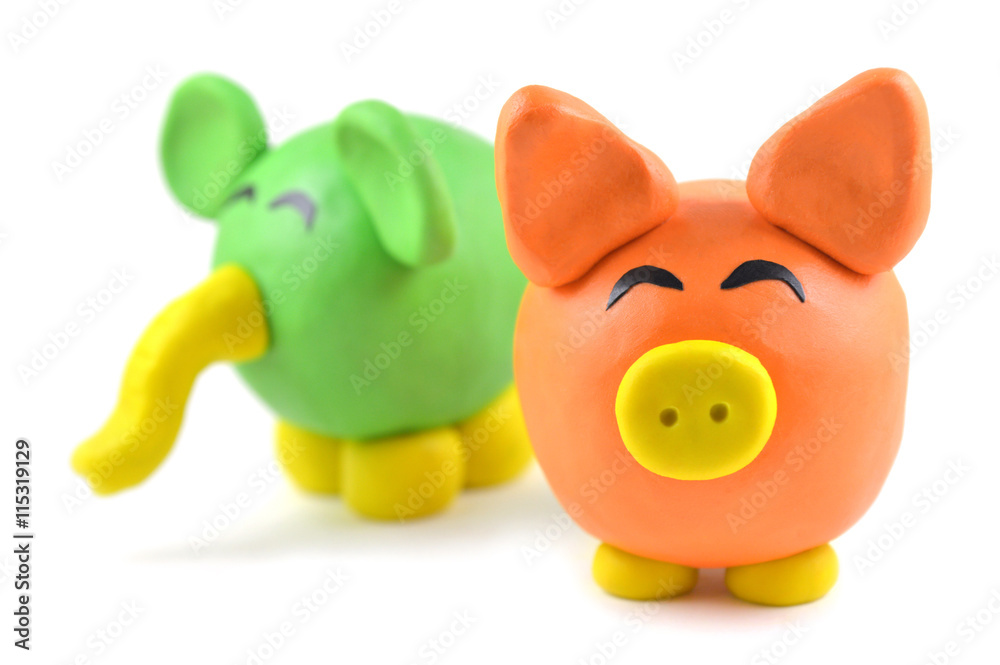 Plasticine pig and elephant on white background Stock Photo | Adobe Stock