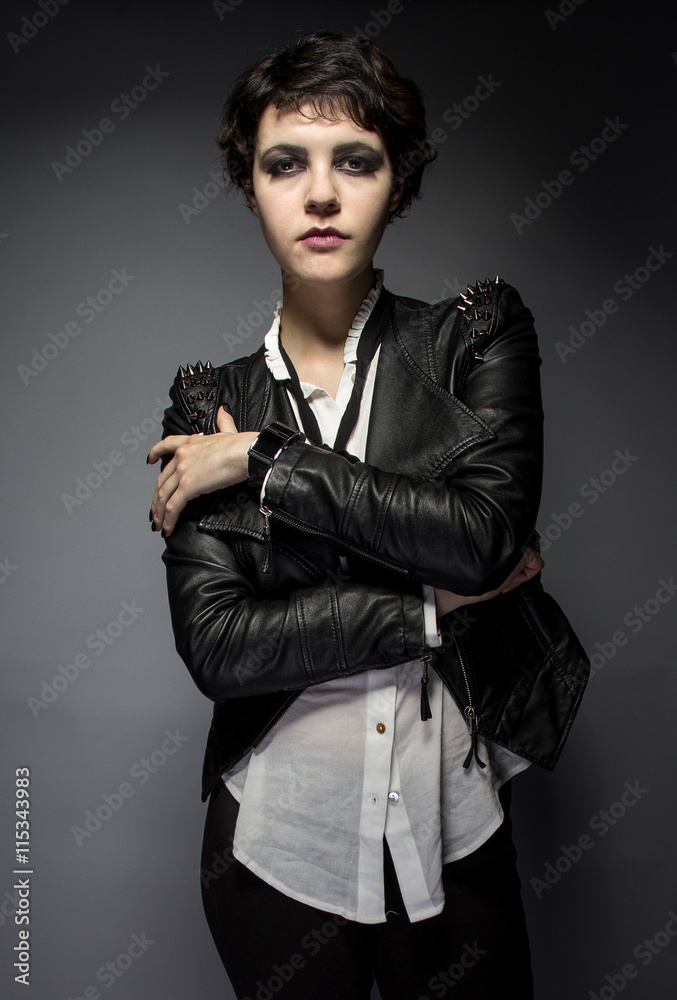 Fashion model wearing black goth style leather with stylish smartwatch ...