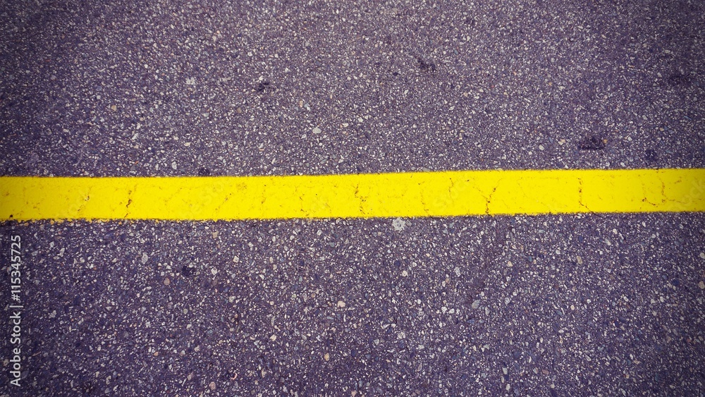 yellow line on street divided between car at parking lot Stock Photo ...