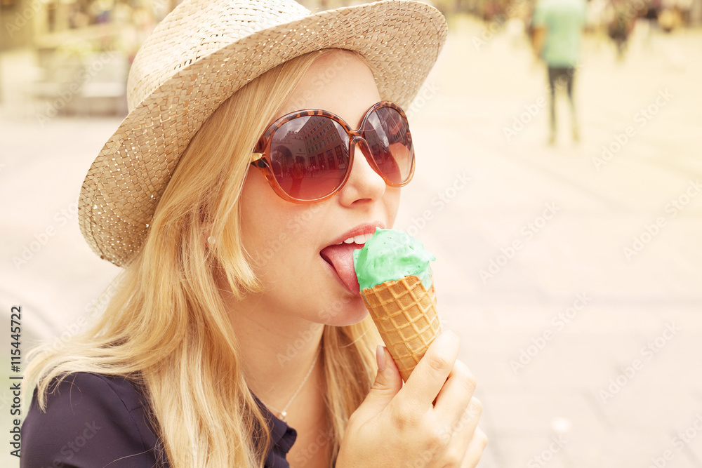 Woman eating ice-cream in the city Stock Photo | Adobe Stock