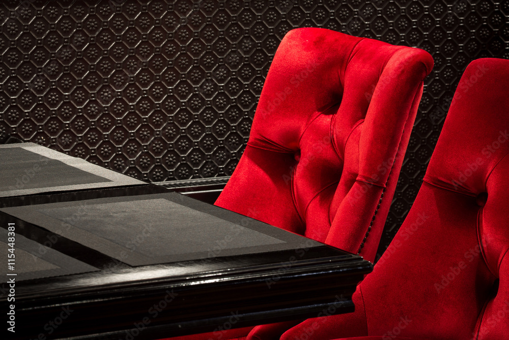 Red velvet chairs and black table Stock Photo | Adobe Stock