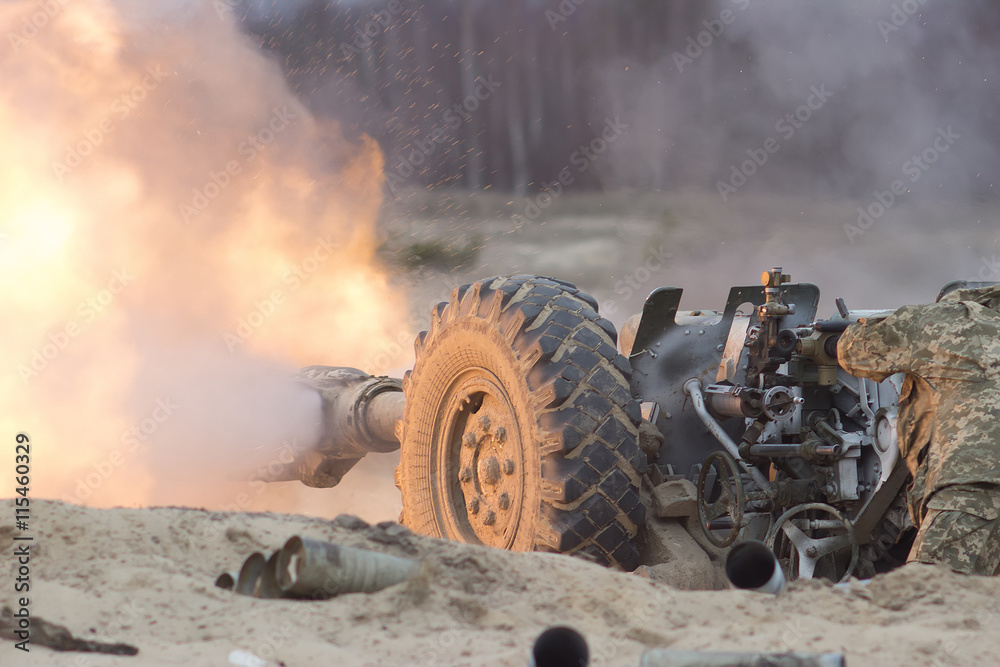 Heavy artillery gun fire on military Stock Photo | Adobe Stock