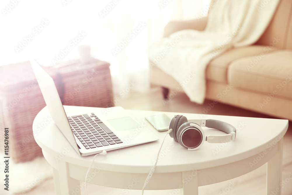 New headphones on the table in the room Stock Photo | Adobe Stock