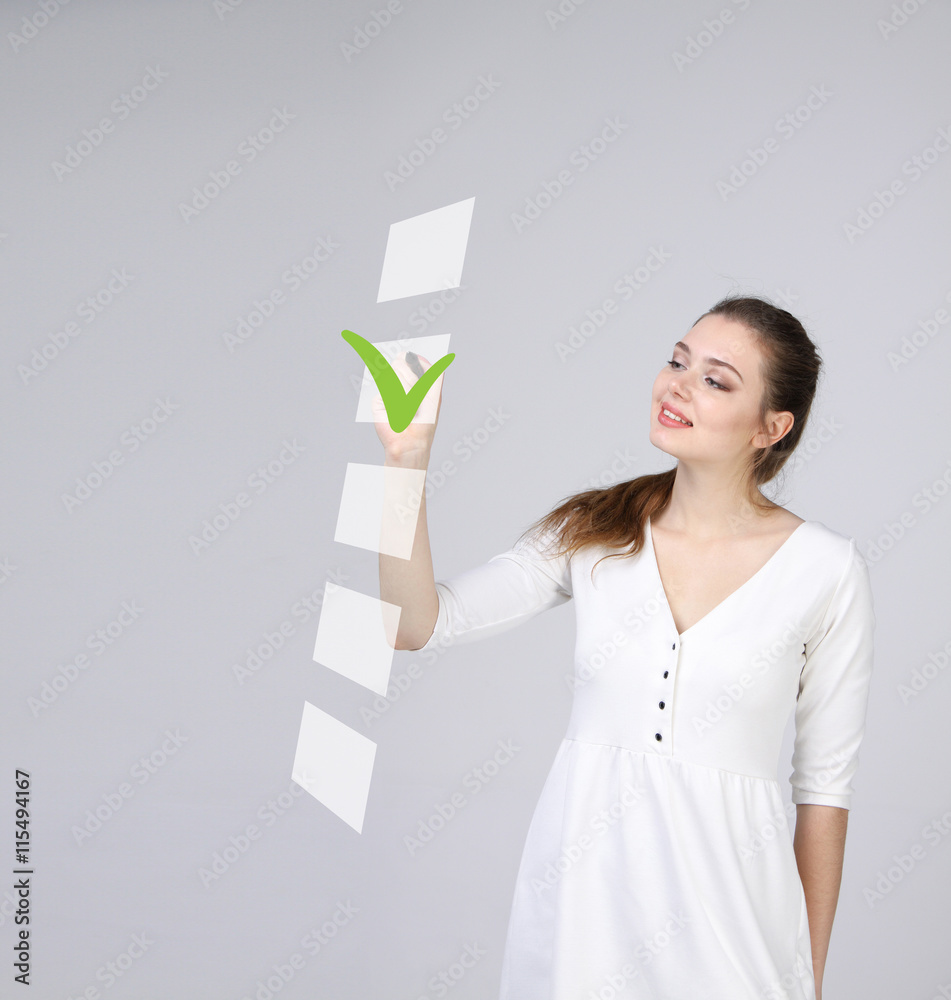 Young business woman checking on checklist box. Gray background. Stock ...