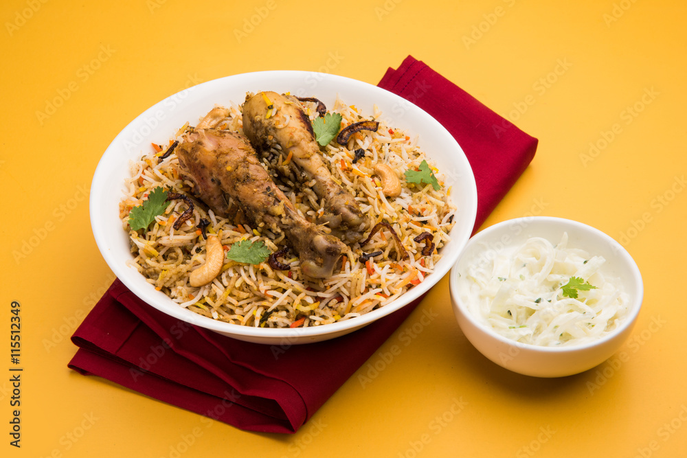 authentic chicken biryani with onion raita Stock Photo | Adobe Stock