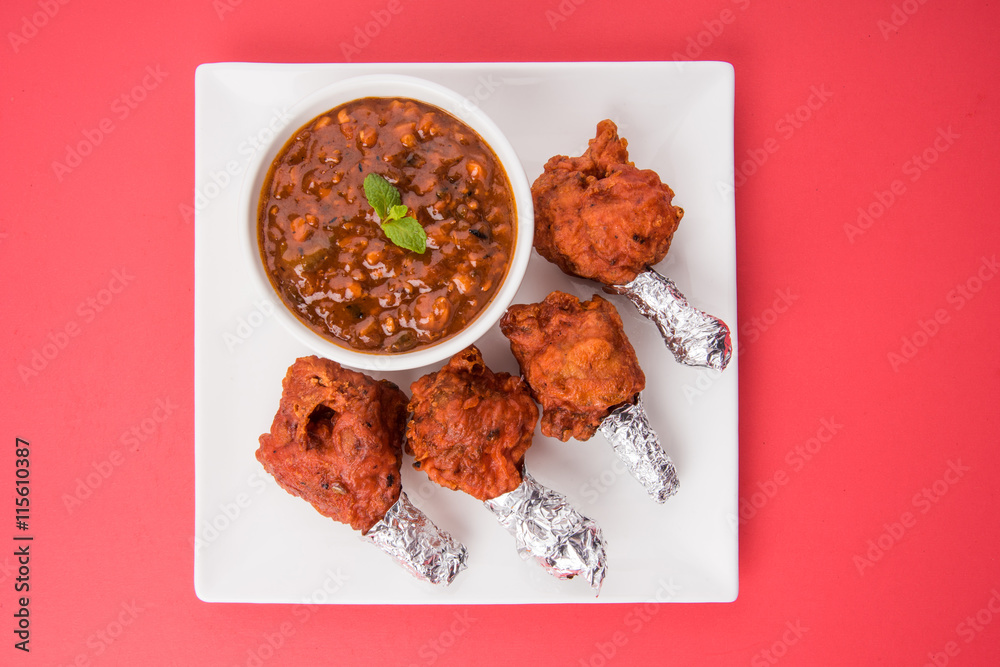 indian or chinese non veg recipe Chicken lollipop Stock Photo | Adobe Stock