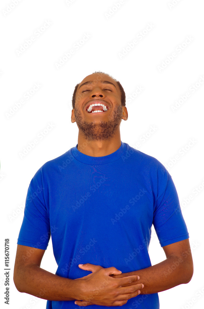 Man wearing strong blue t-shirt standing and laughing hard holding his ...