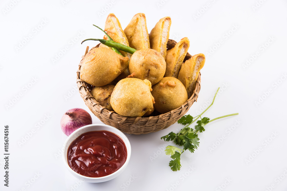 black gram or urad dal vada or pakoda or aalu bonda, aalu bonde with ...