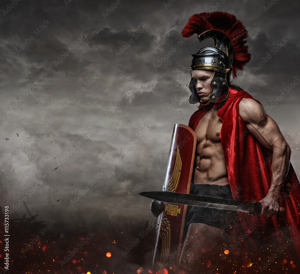 Male in spartan costume holding sword and shield. Stock Photo | Adobe Stock
