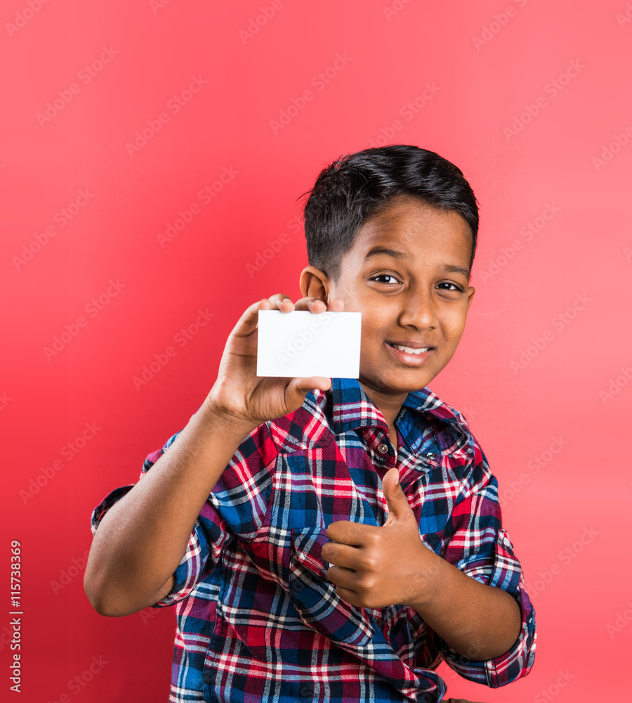 indian kid holding white card, indian boy and card, indian kid or indian boy with white card or ...
