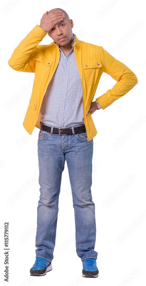 Young man puts right hand on a forehead. Looks like that he did ...