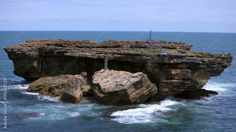 Rocky Pulau Jumpino island at Pantai Kukup beach in Java, Indonesia ...