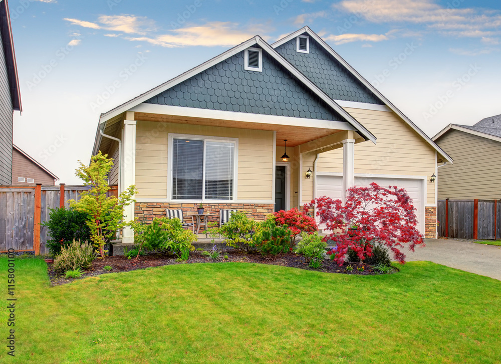 Beautiful curb appeal of sweet beige house with green front garden ...