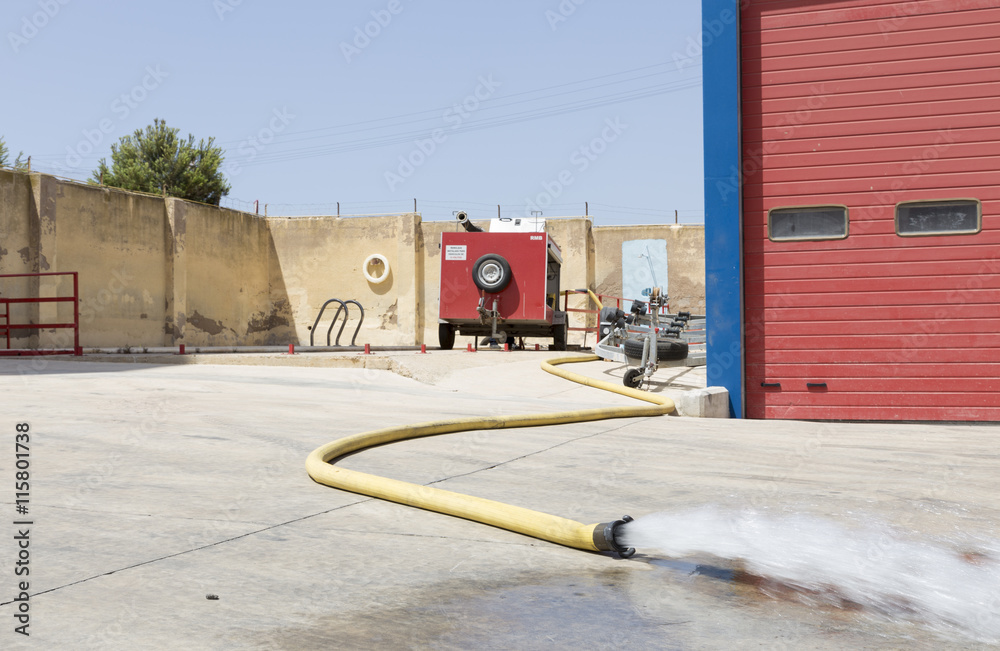Fire pump bailing water from a pool Stock Photo | Adobe Stock