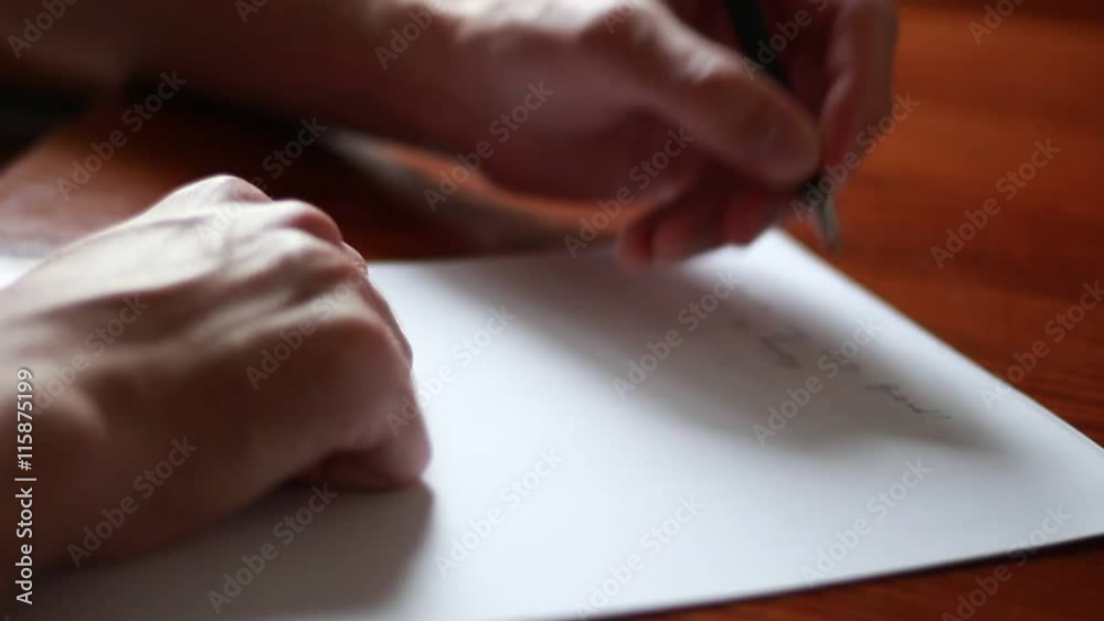 Man writing a letter with left hand Stock-Video | Adobe Stock