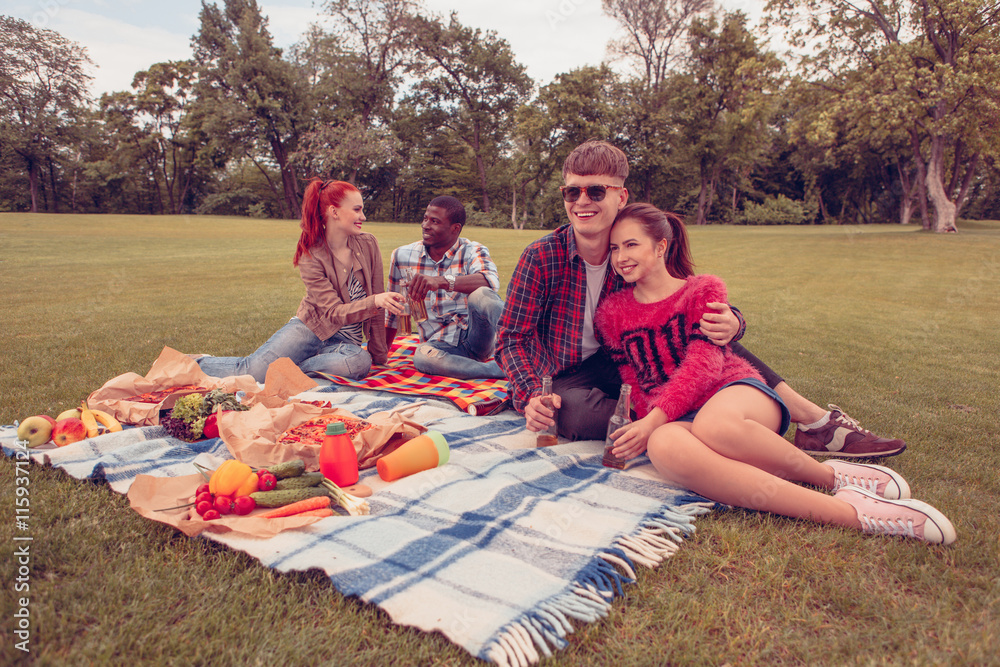 Image of happy couples having picnic in park all together. Cheerful and ...